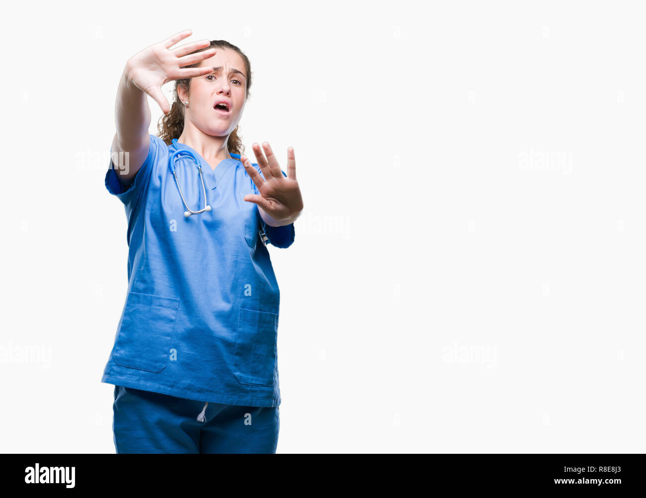 Young brunette doctor girl wearing nurse or surgeon uniform over ...