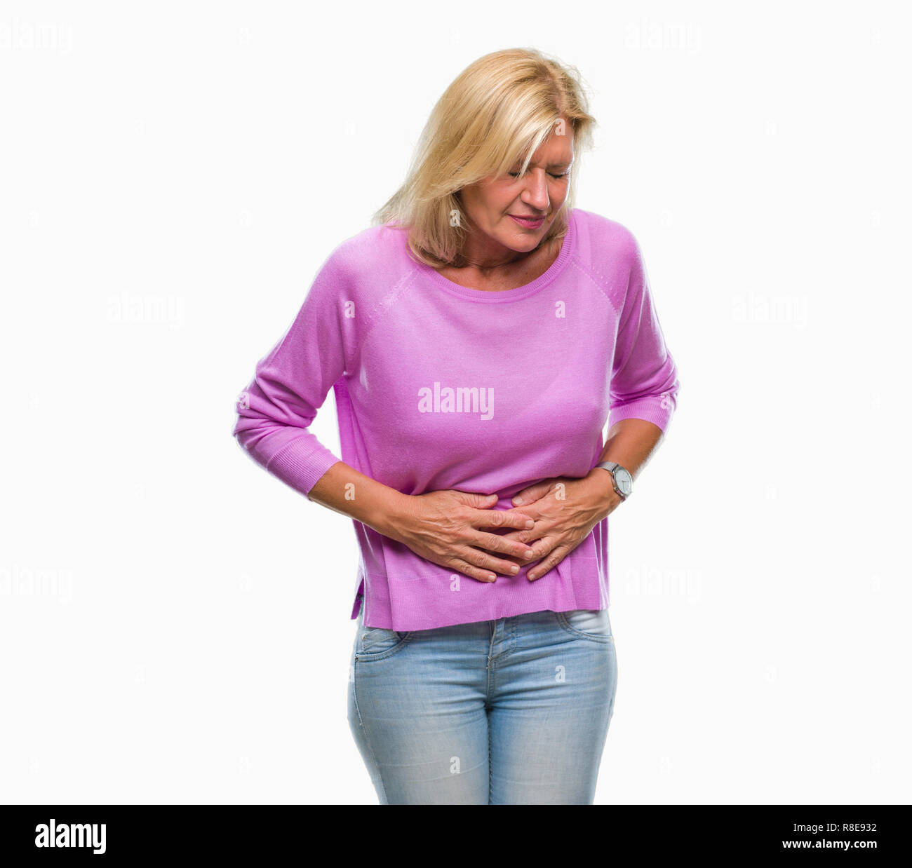 Middle age blonde woman over isolated background with hand on stomach ...