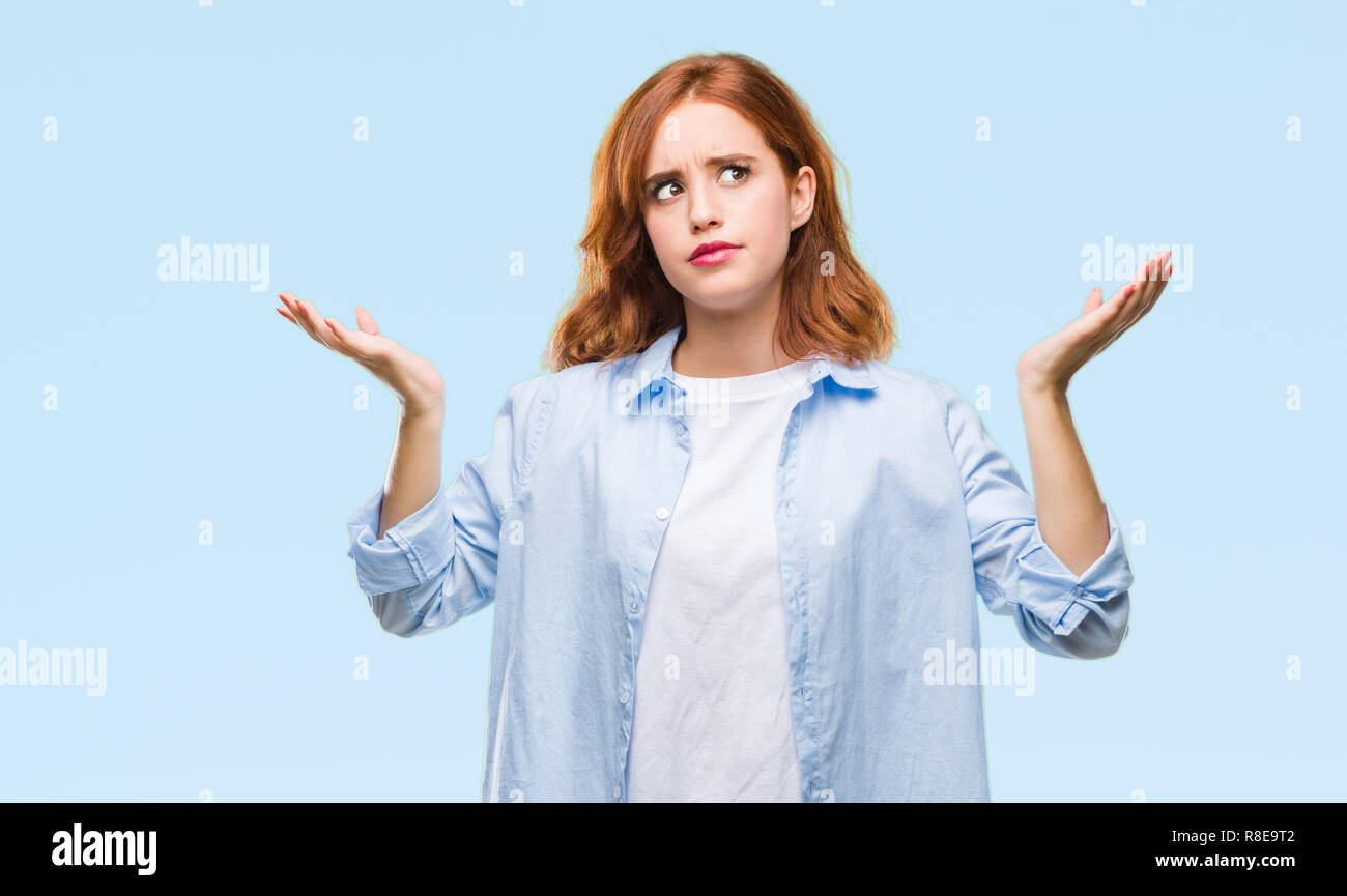 Young beautiful business woman over isolated background clueless and ...
