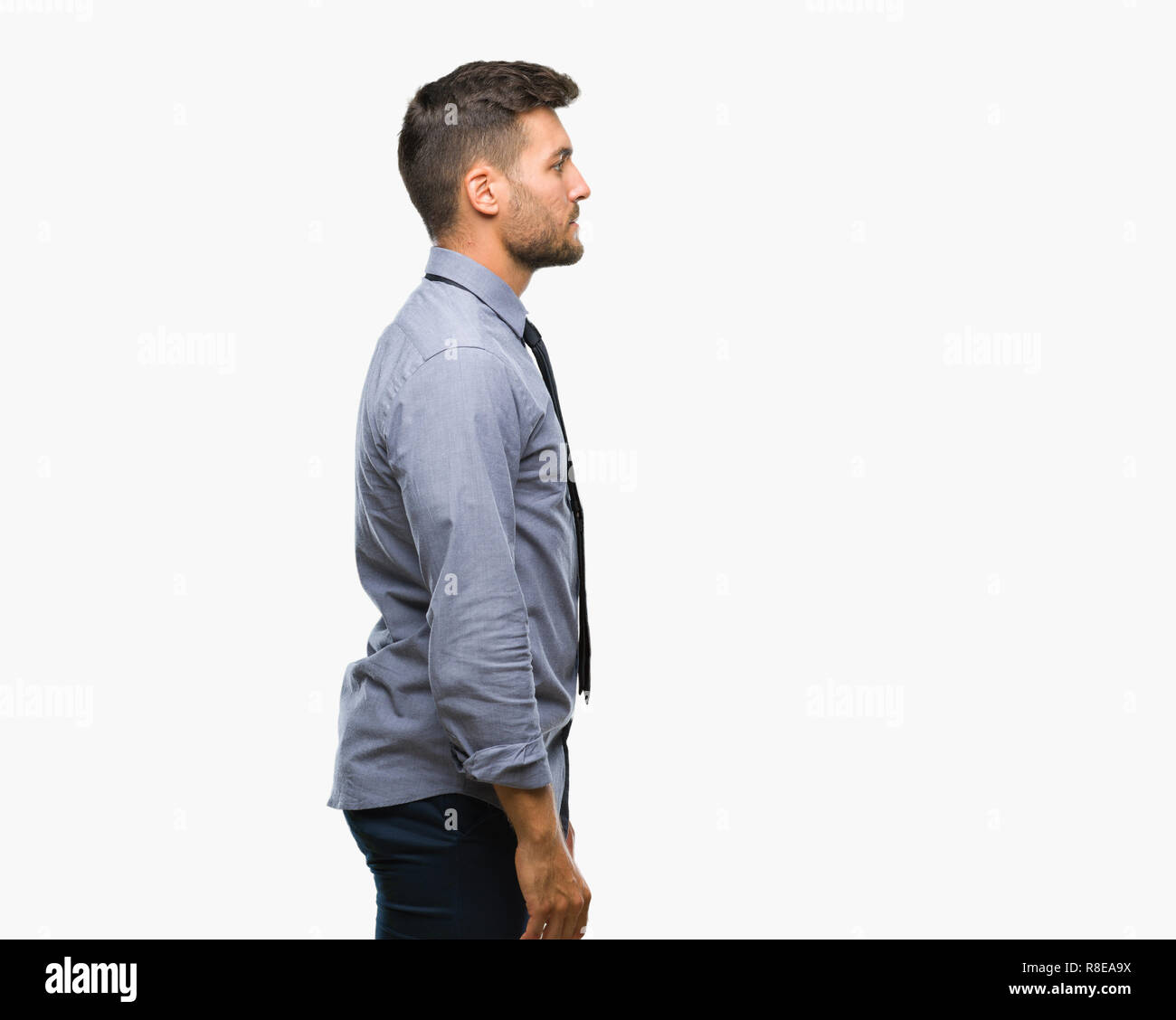 Young handsome business man over isolated background looking to side ...