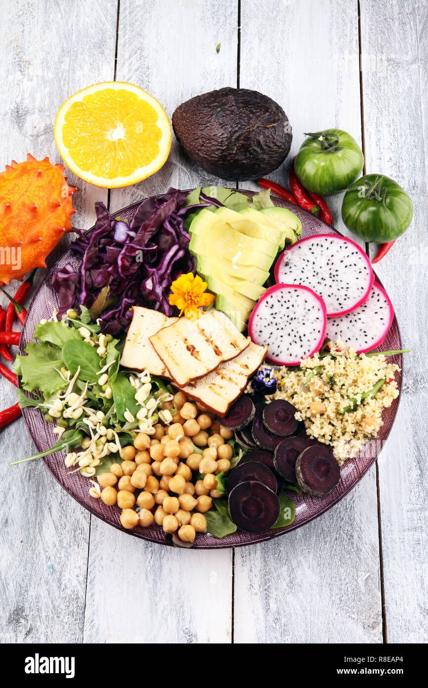grilled tofu and dragon fruit buddha bowl with vegetable and humus ...