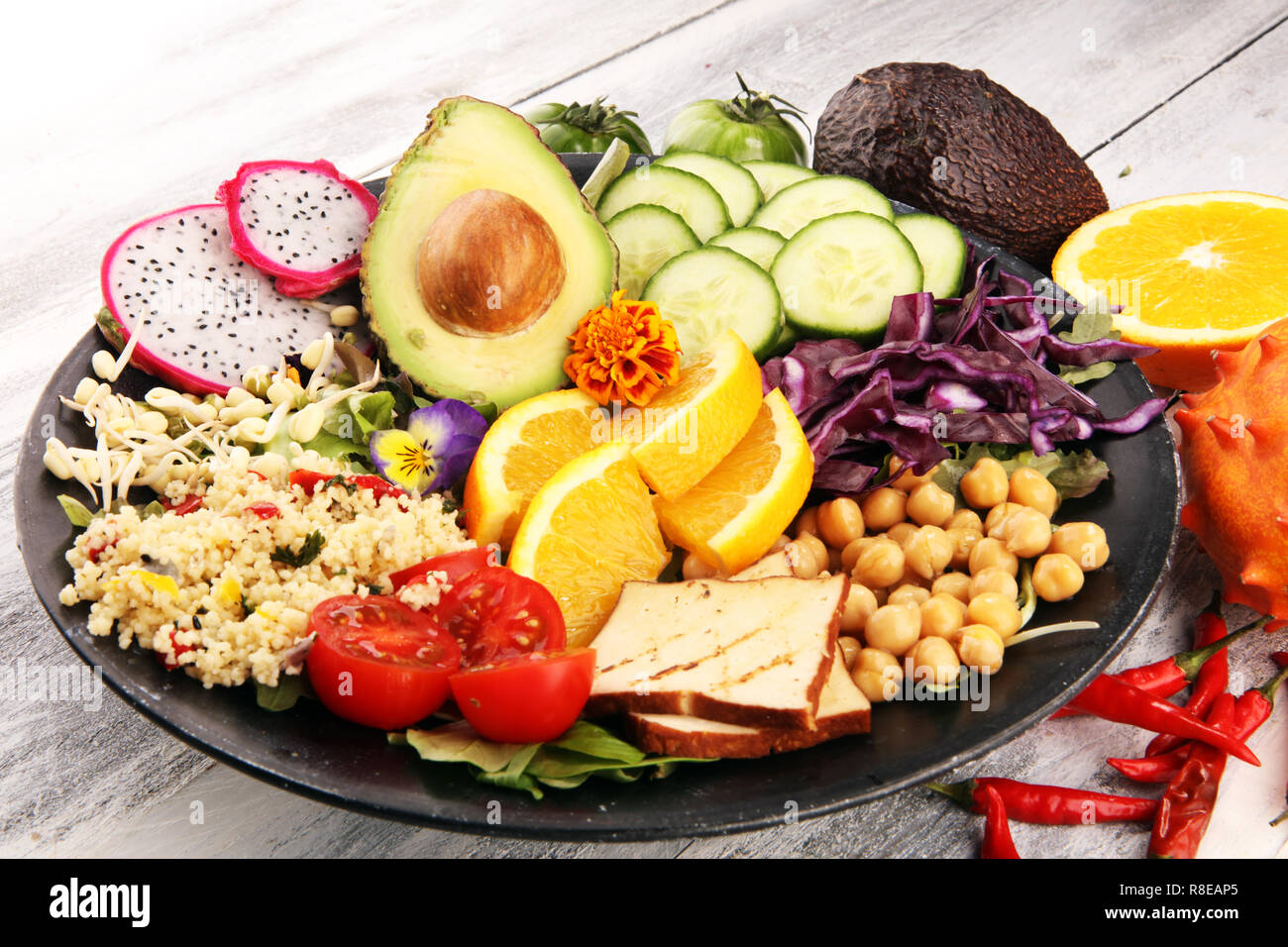grilled tofu and dragon fruit buddha bowl with vegetable and humus ...