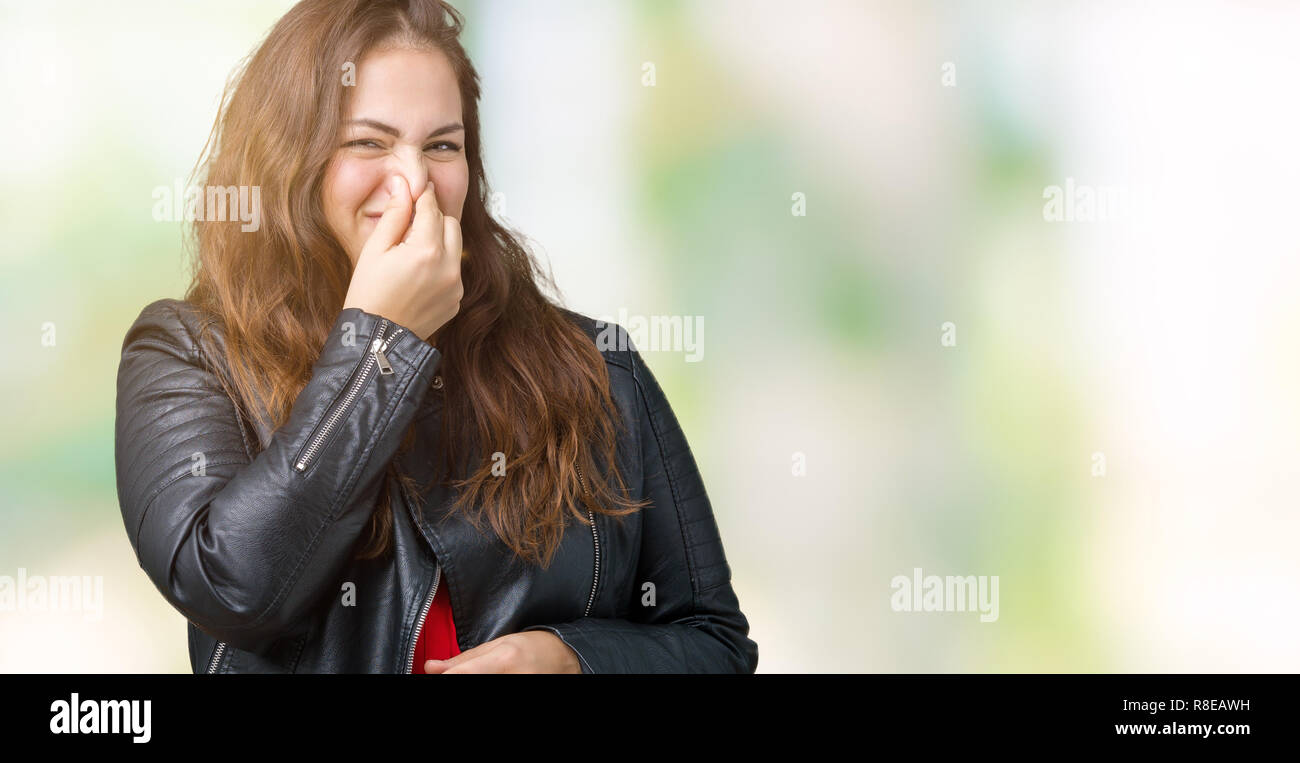Beautiful plus size young woman wearing a fashion leather jacket over ...