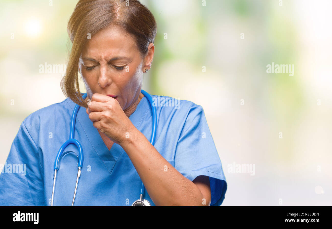 Middle age senior nurse doctor woman over isolated background feeling ...