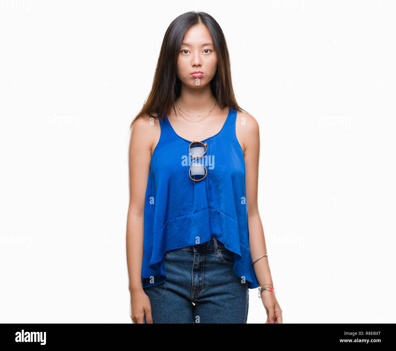 Young asian woman over isolated background depressed and worry for ...