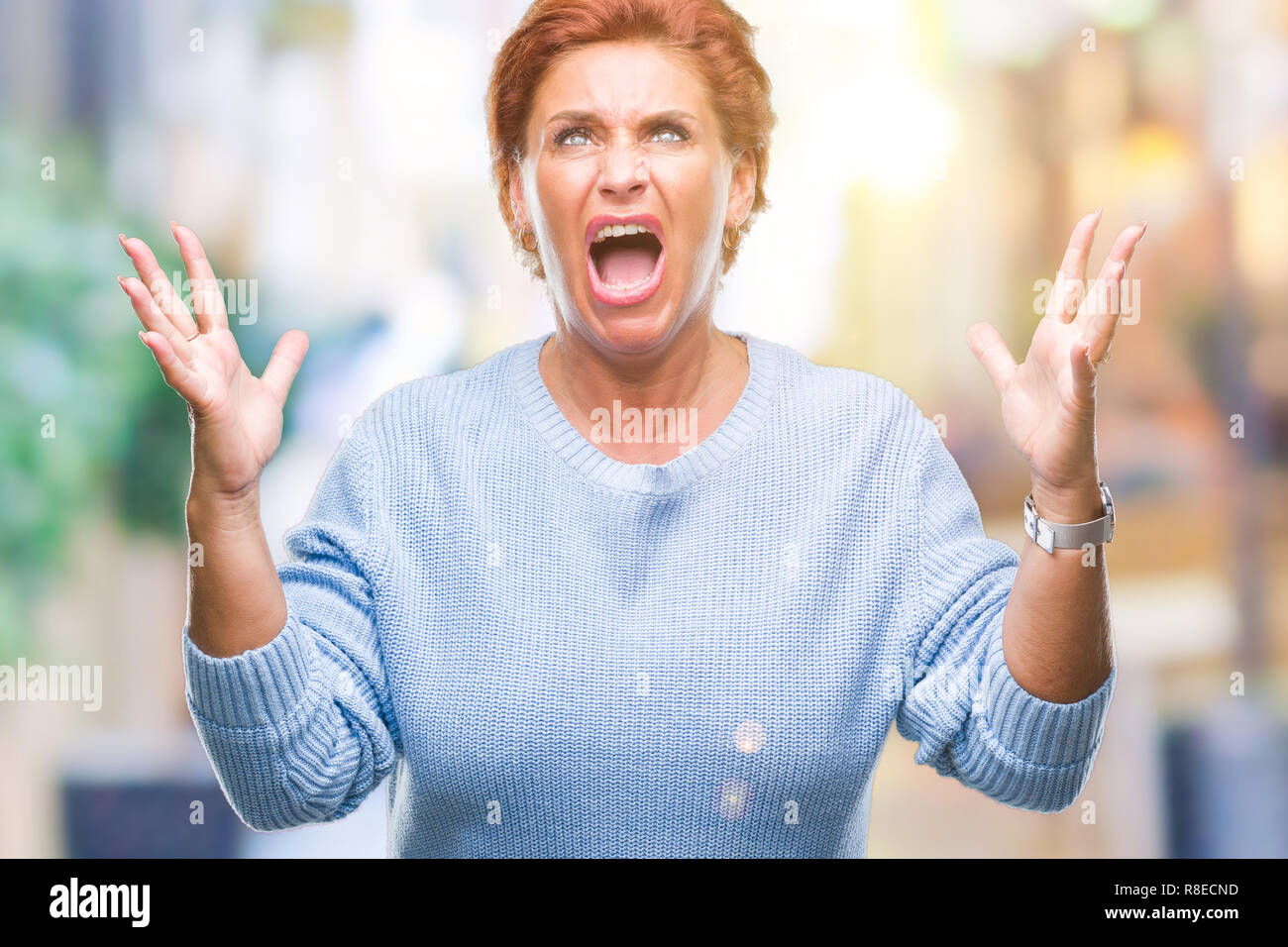 Atrractive senior caucasian redhead woman over isolated background ...