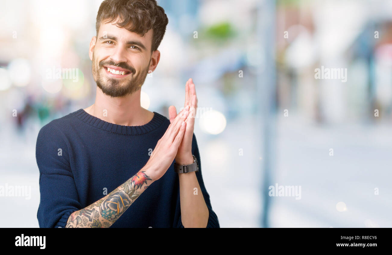 Young handsome man over isolated background Clapping and applauding ...