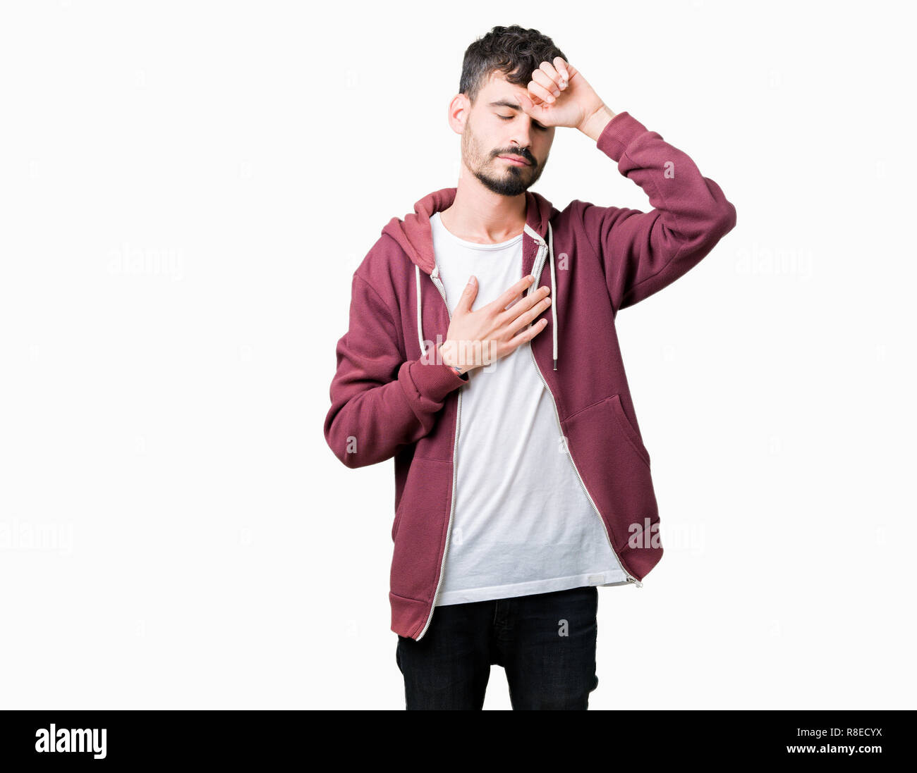 Young handsome man over isolated background Touching forehead for ...