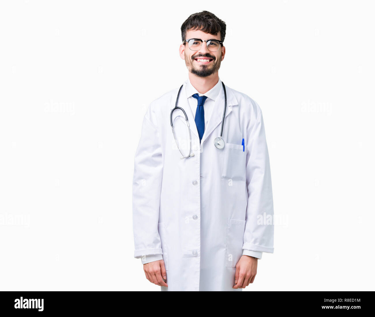 Young doctor man wearing hospital coat over isolated background with a ...