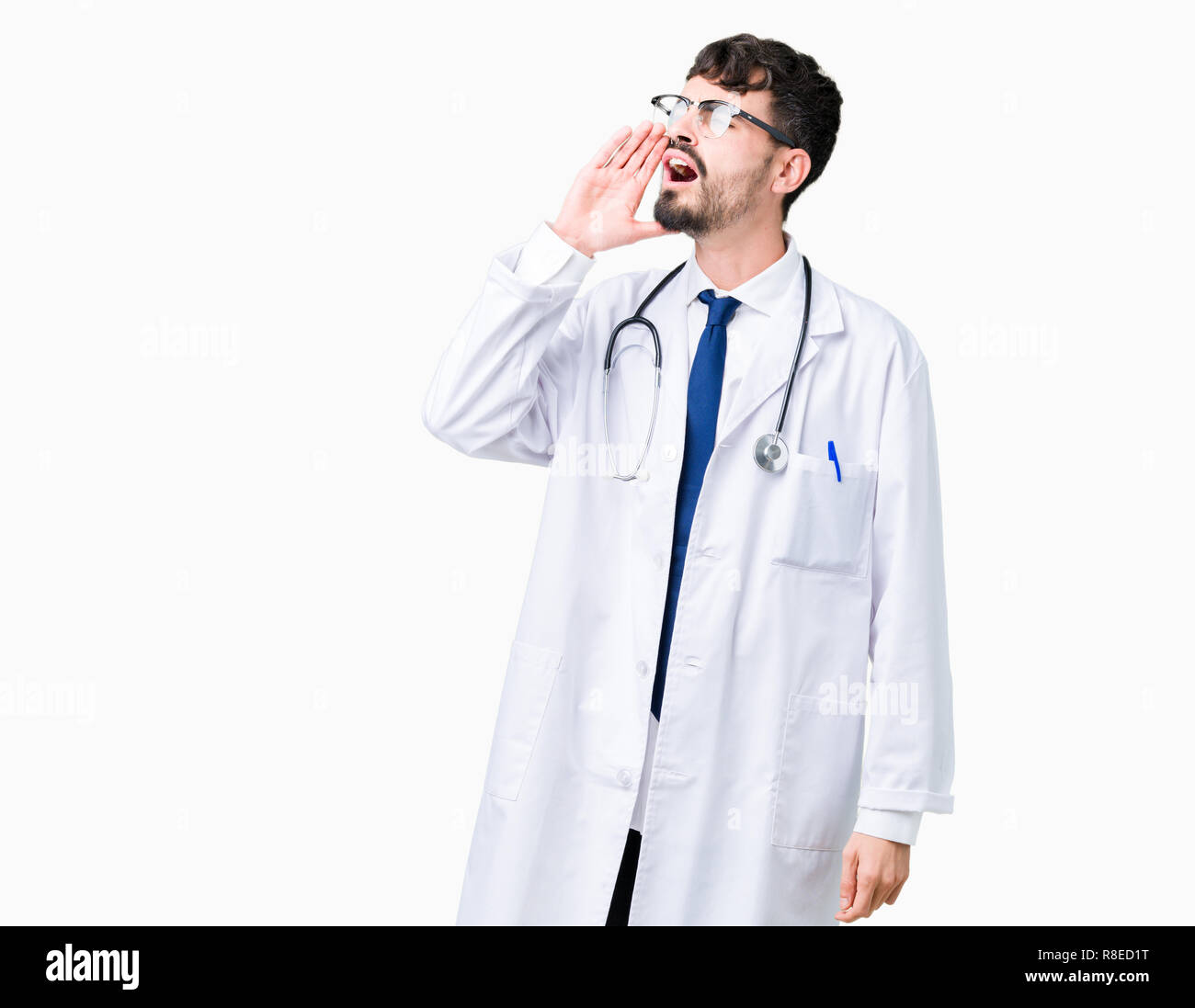 Young doctor man wearing hospital coat over isolated background ...