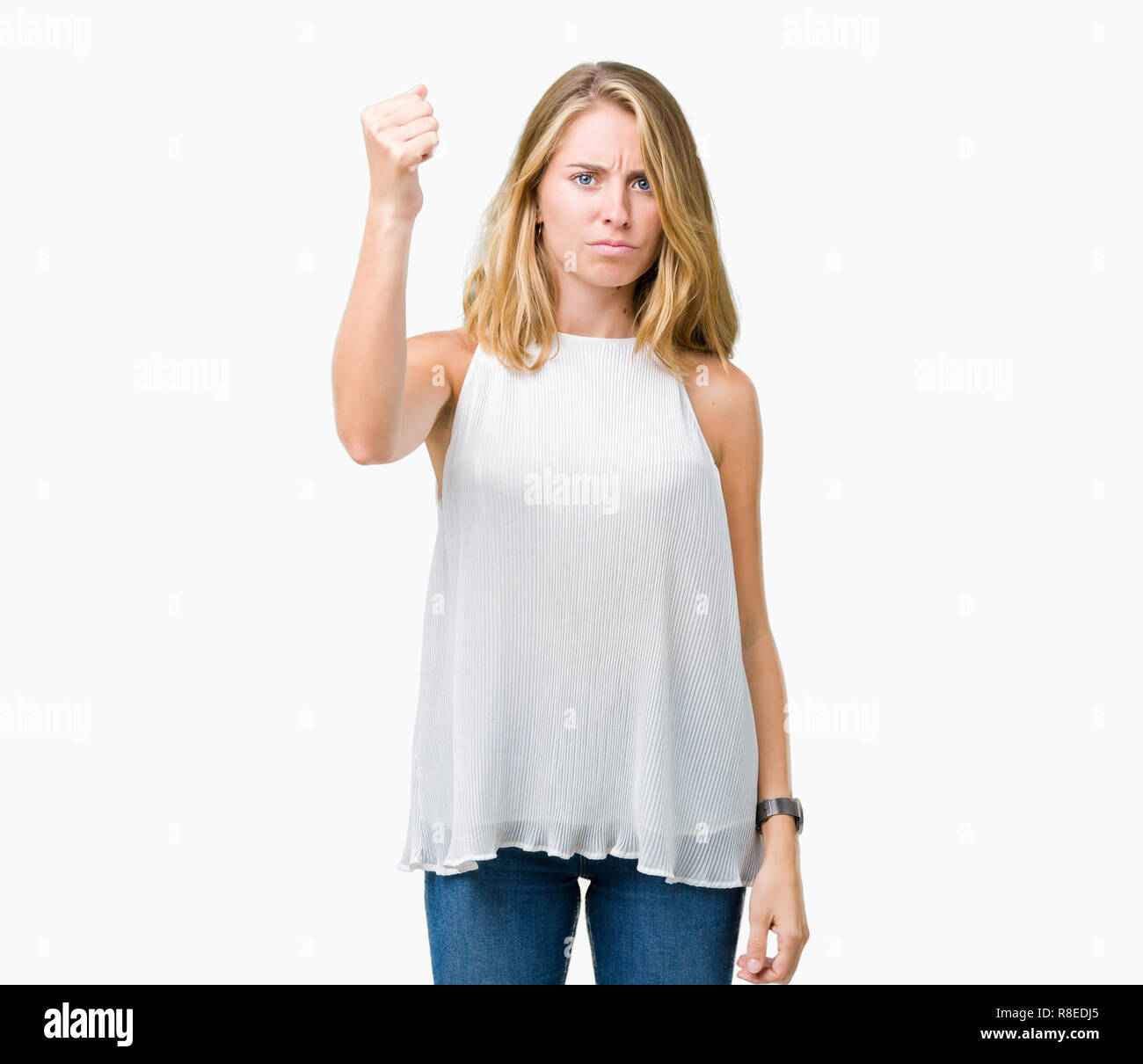 Beautiful young elegant woman over isolated background angry and mad ...