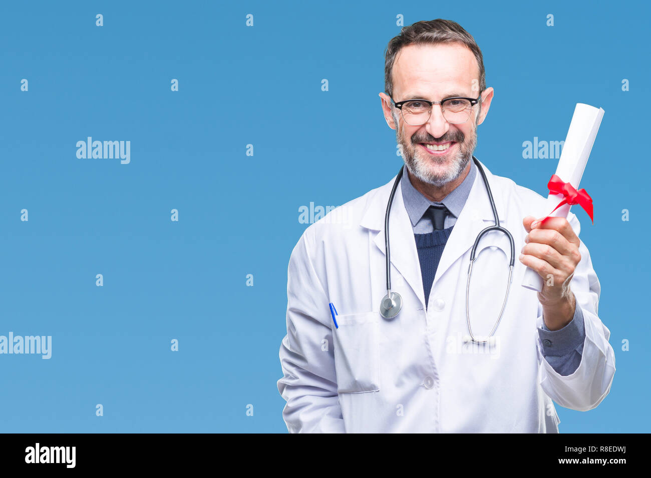 Middle age senior hoary doctor man holding degree certificate over ...