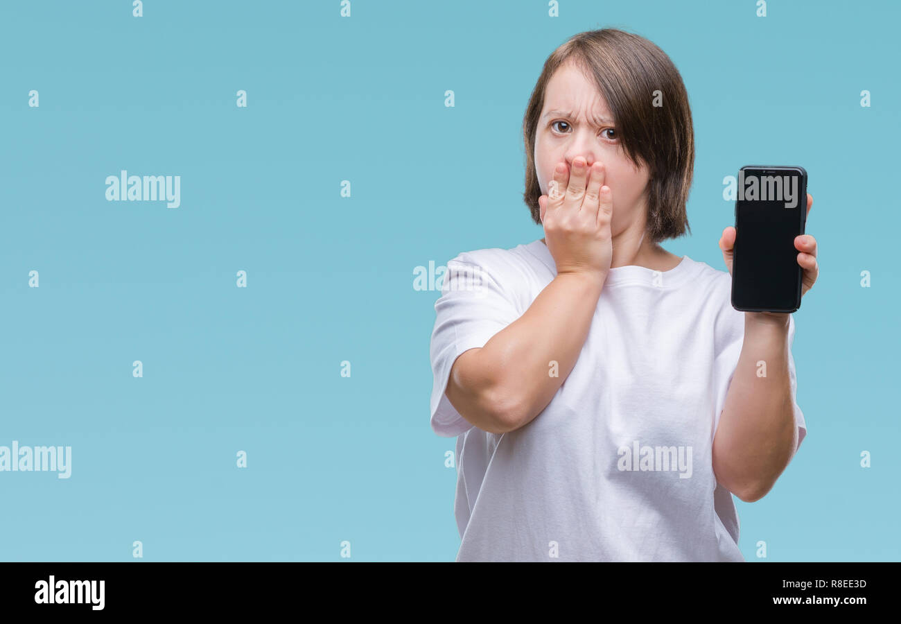 Young adult woman with down syndrome showing smartphone screen over ...