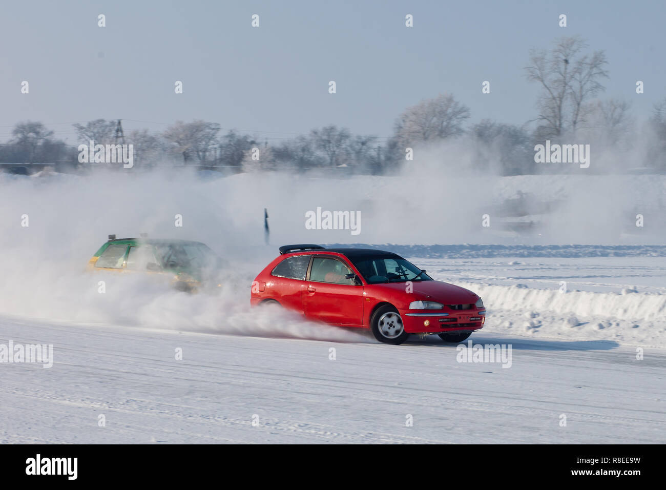 Red car moving on ice with blured background Stock Photo - Alamy