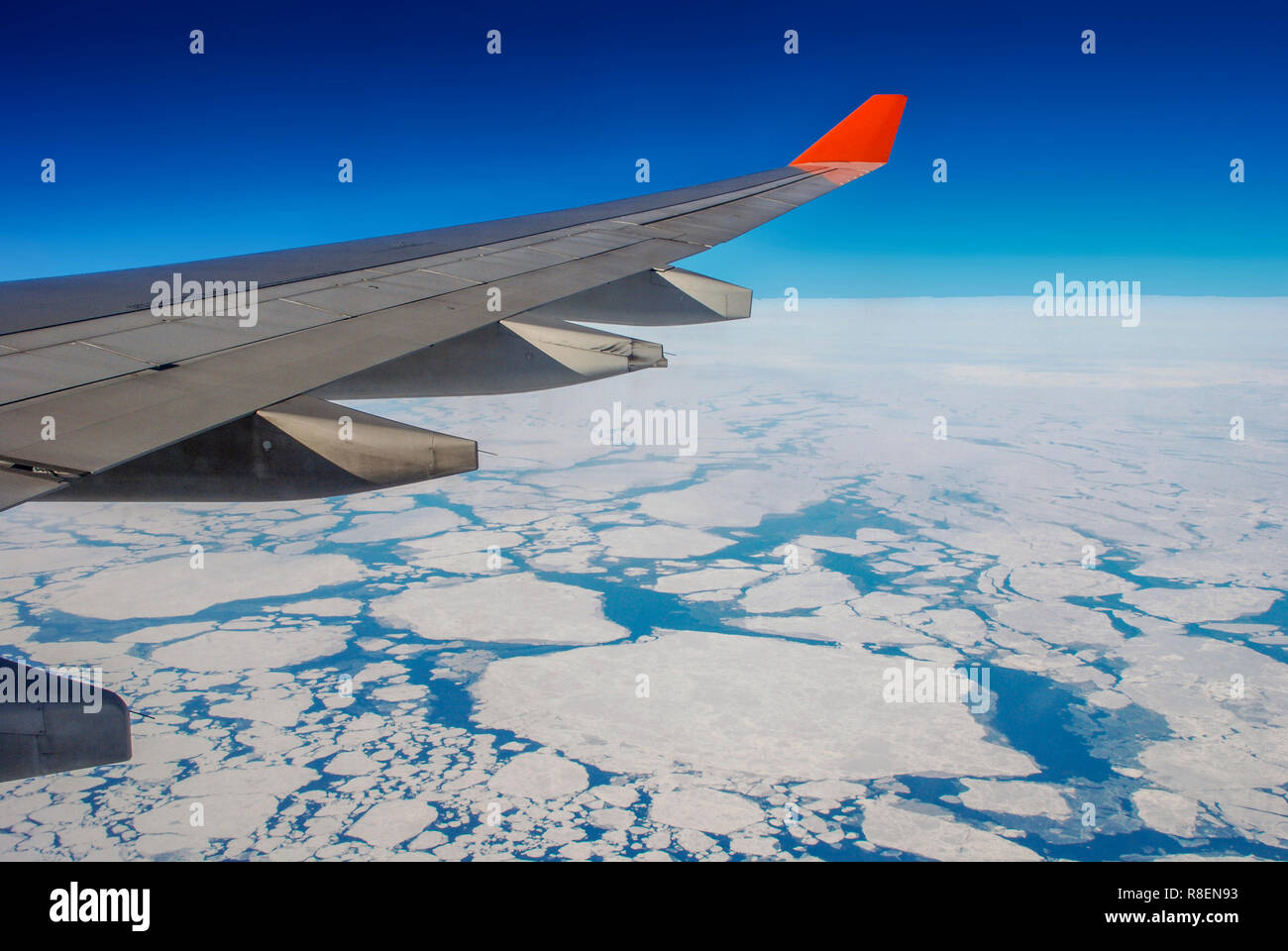 Aircraft wing over the Arctic ocean, icebergs Stock Photo - Alamy