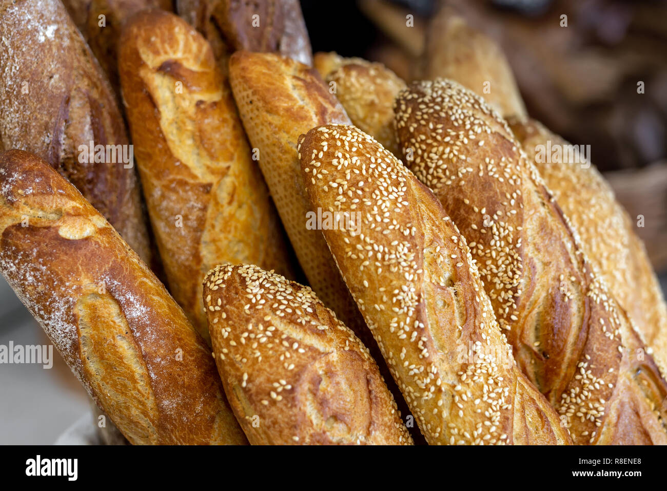Traditional crusty French bread baguette in basket at bakery. Fresh ...