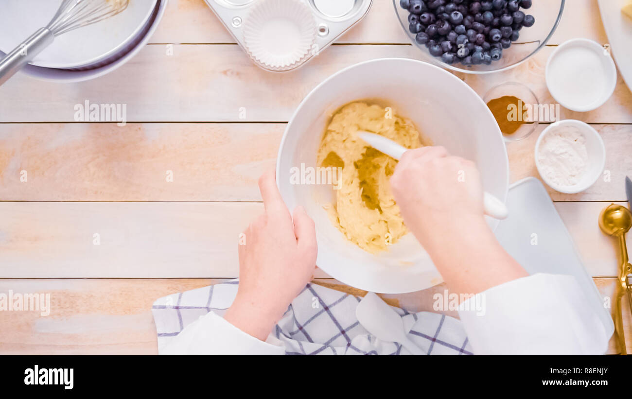 Mixing ingredients together in mixing bowl for blueberry muffins Stock ...