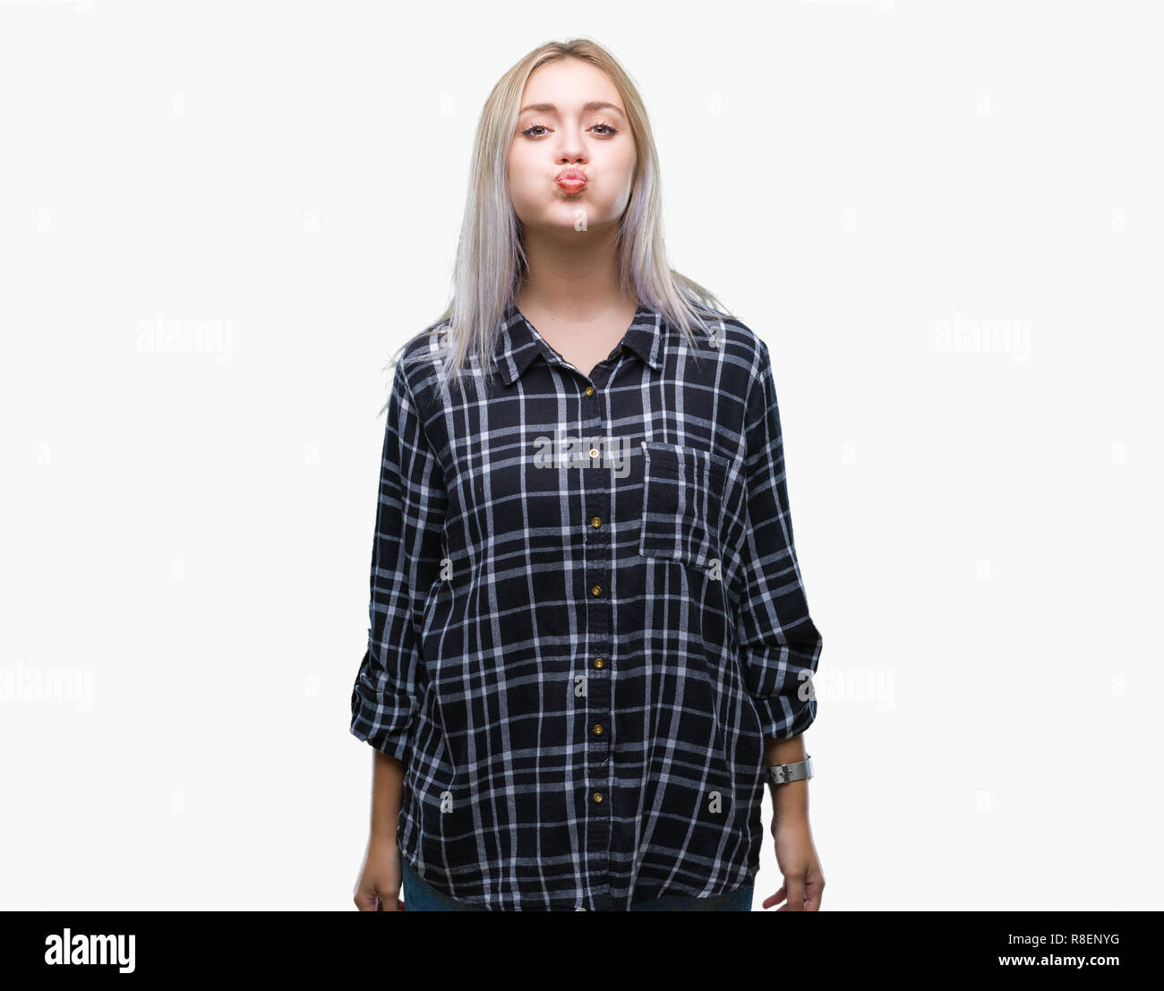Young blonde woman over isolated background puffing cheeks with funny ...