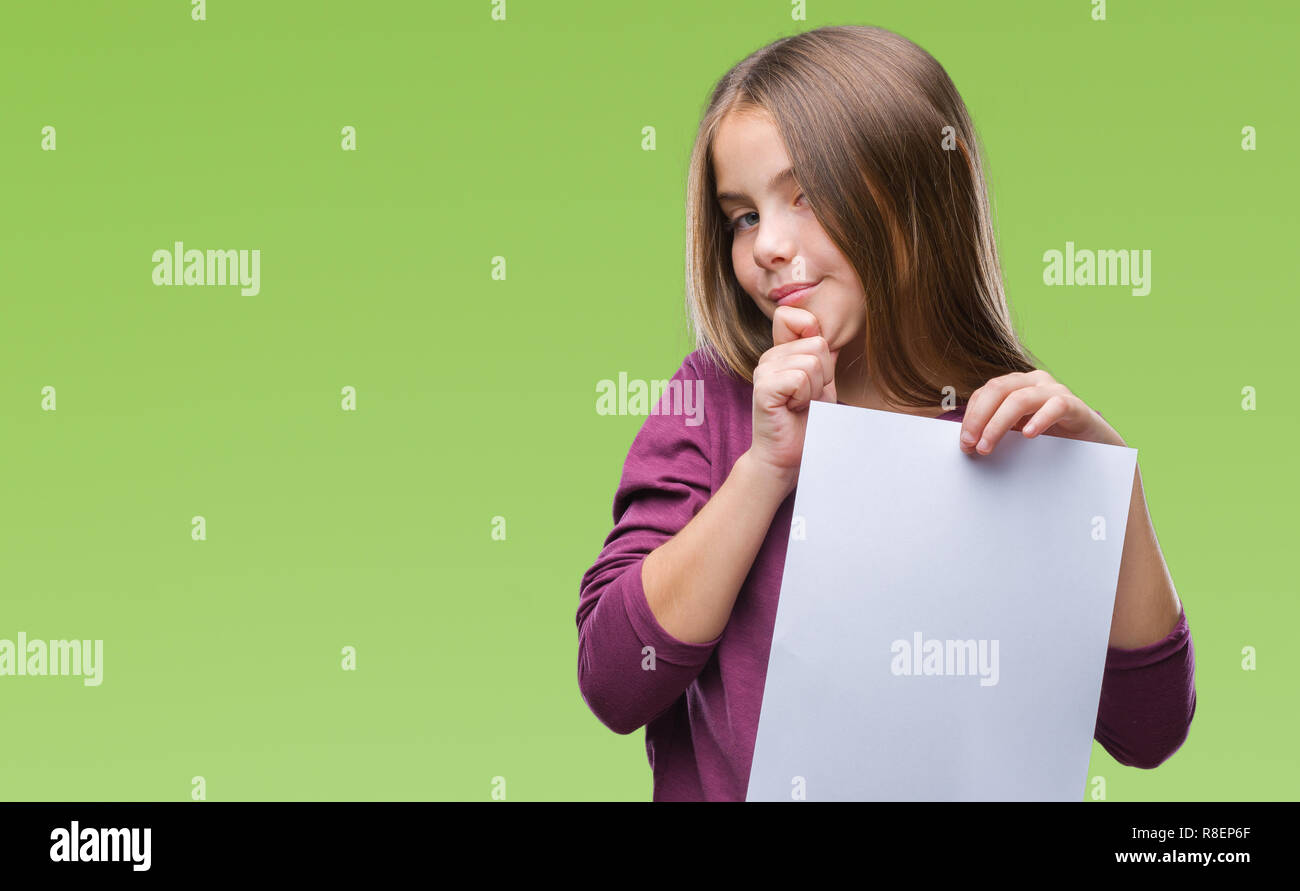 Young beautiful girl holding blank sheet paper over isolated background ...