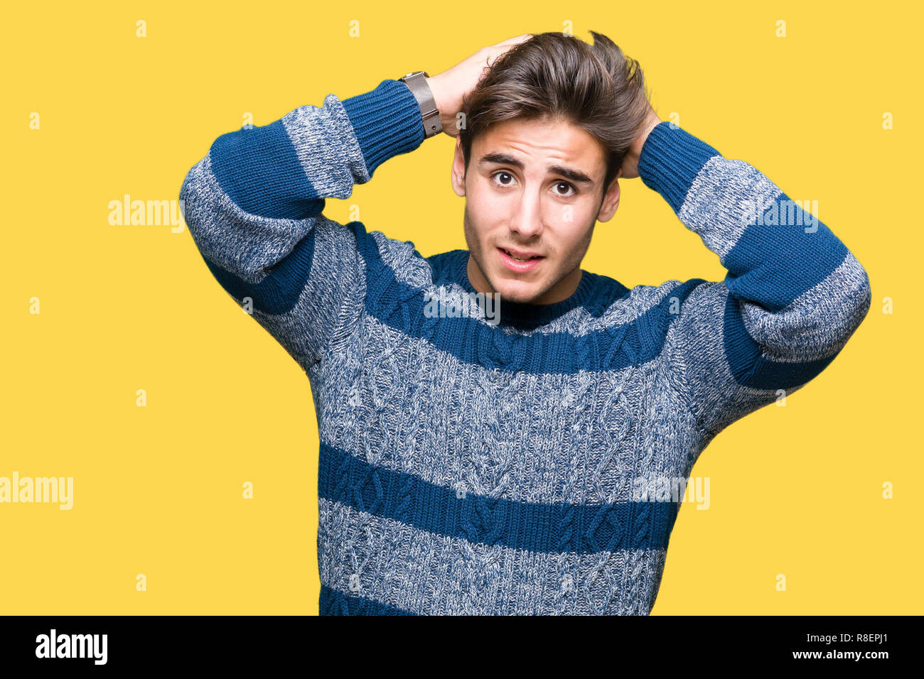 Young handsome man over isolated background Crazy and scared with hands ...