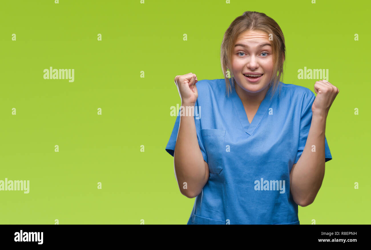 Young caucasian nurse woman wearing surgeon uniform over isolated ...