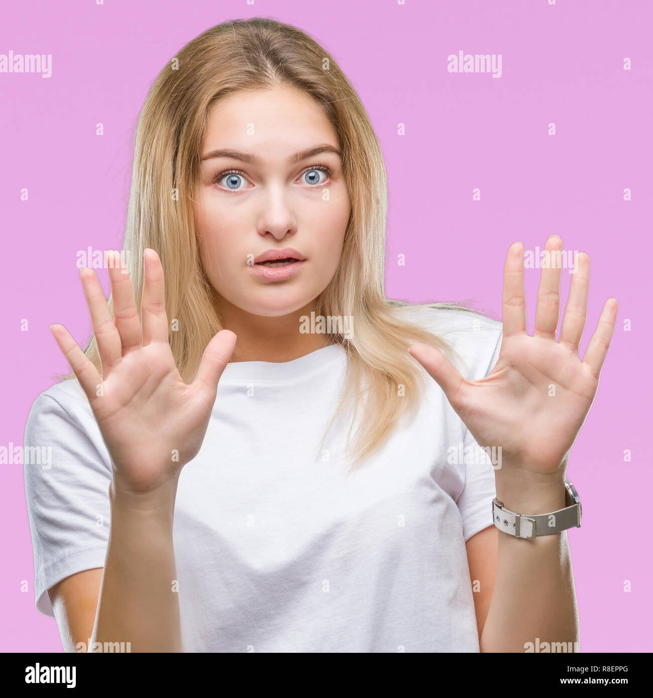 Young caucasian woman over isolated background afraid and terrified ...
