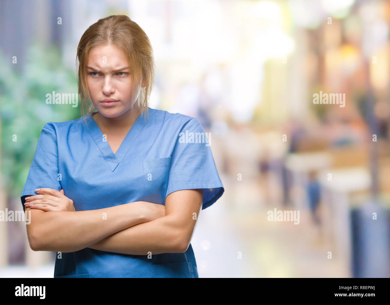 Young caucasian nurse woman wearing surgeon uniform over isolated ...