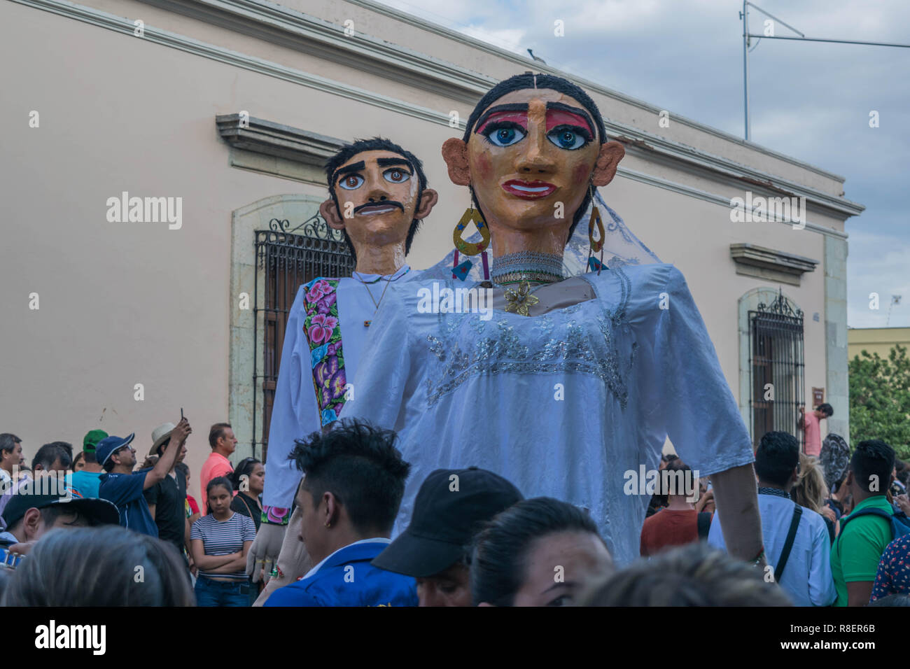 Giant male and female wedding puppets mimicking a bride and groom, on ...