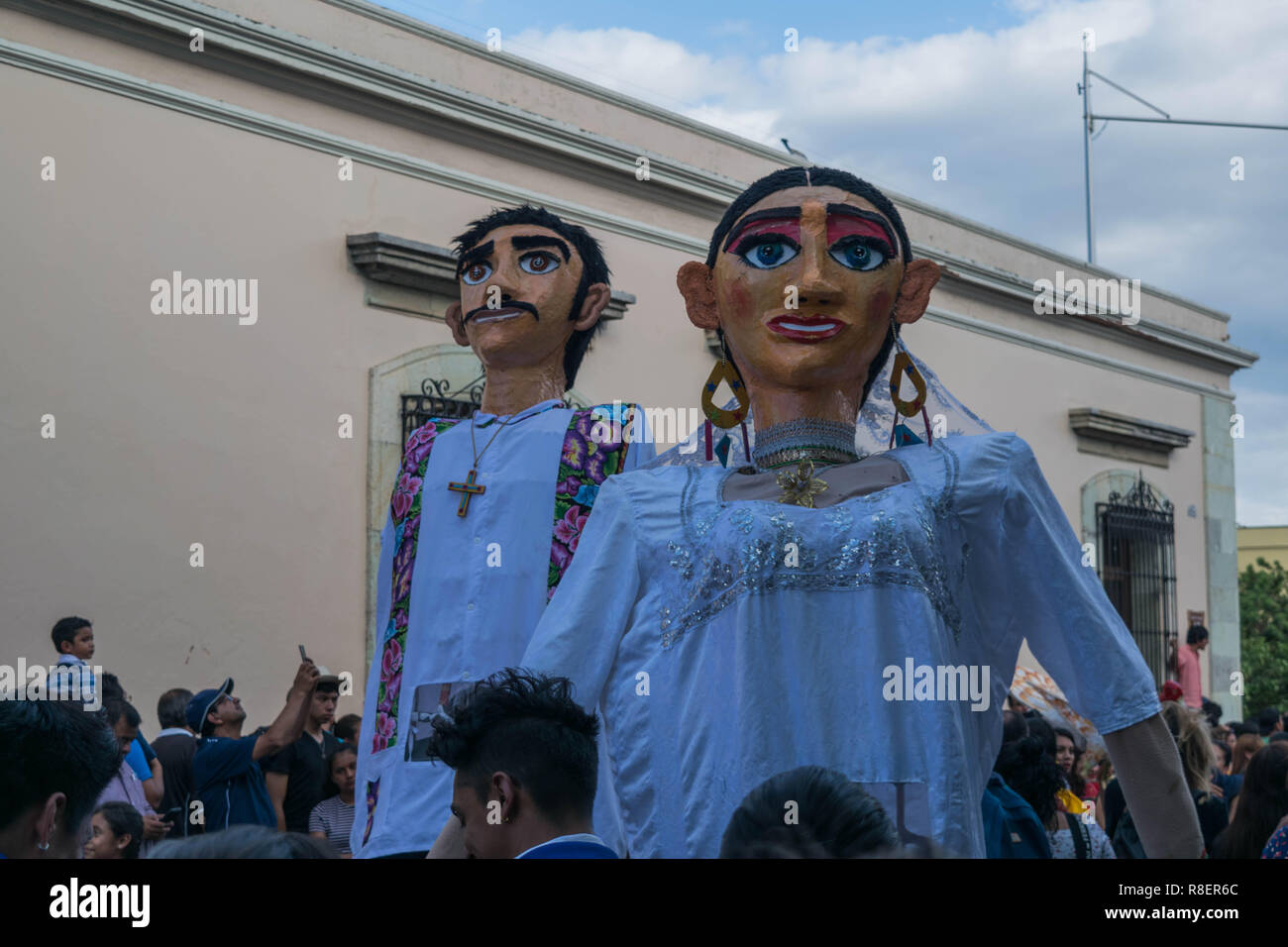 Giant male and female wedding puppets mimicking a bride and groom, on ...