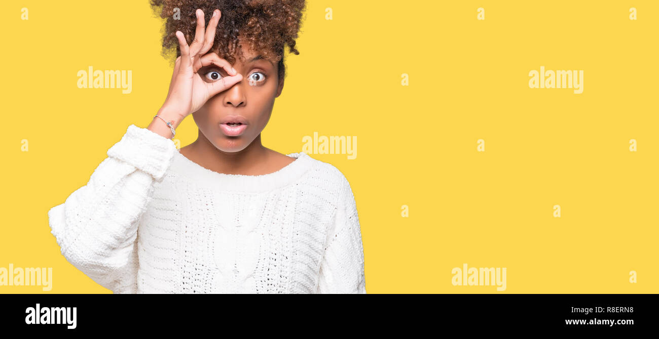 Beautiful young african american woman wearing winter sweater over ...