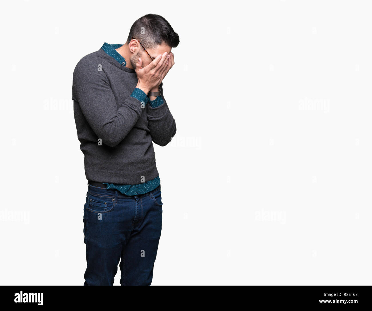 Young handsome man wearing glasses over isolated background with sad ...