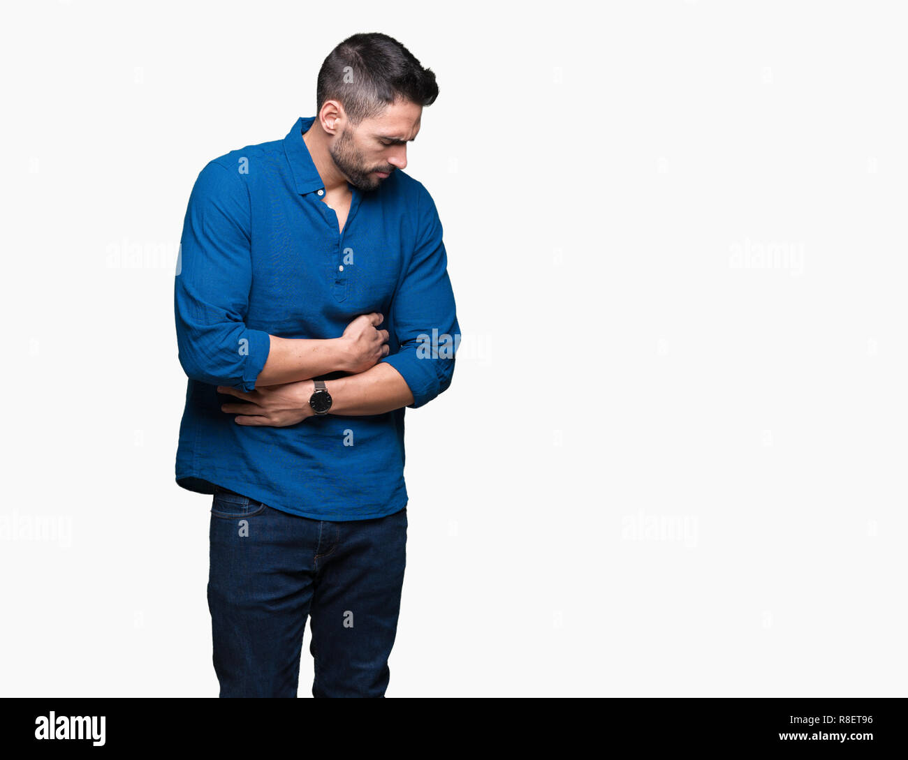 Young handsome man over isolated background with hand on stomach ...