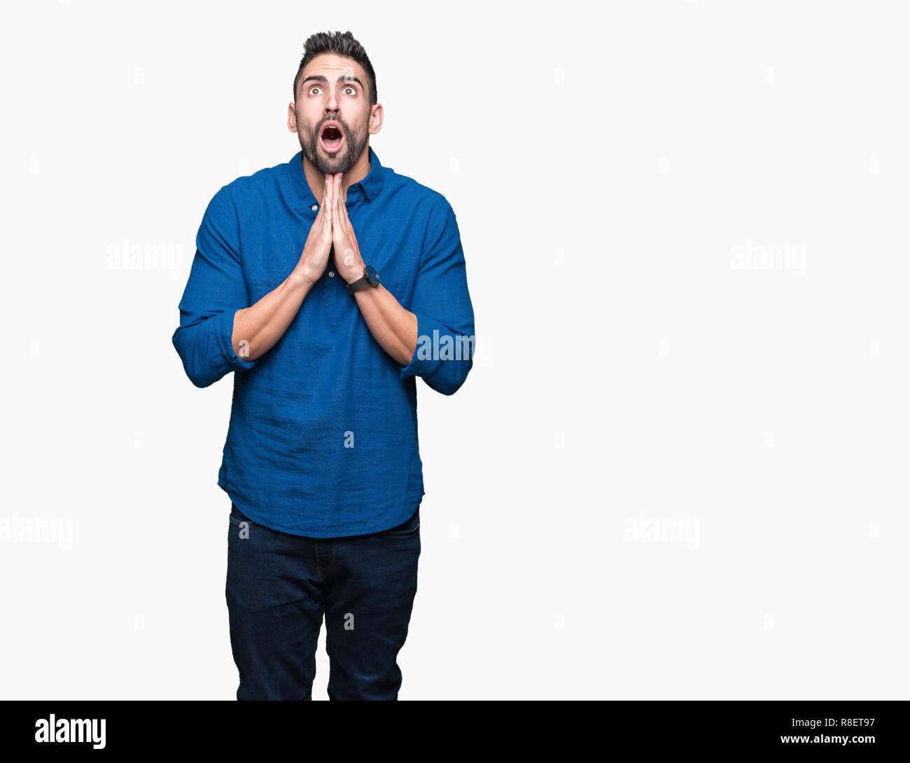 Young handsome man over isolated background begging and praying with ...