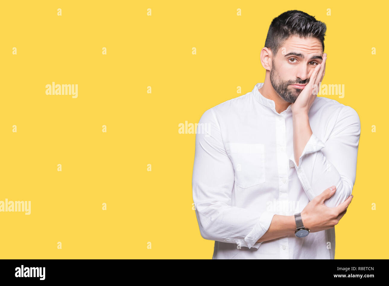 Young business man over isolated background thinking looking tired and ...