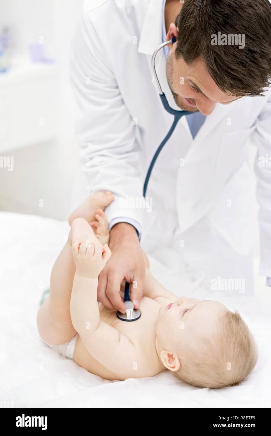 Doctor examining baby with stethoscope Stock Photo - Alamy