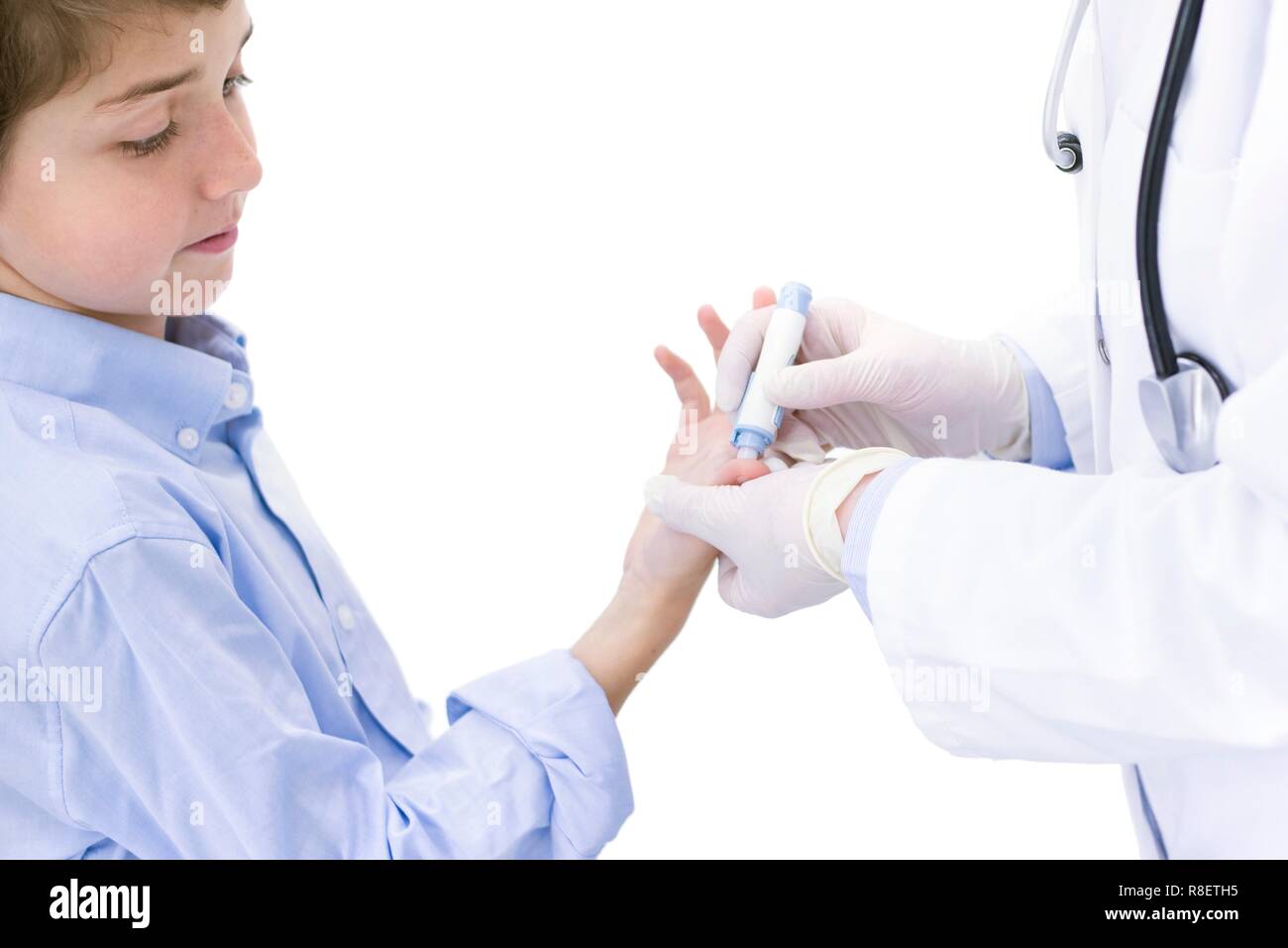 Boy having finger prick test Stock Photo - Alamy