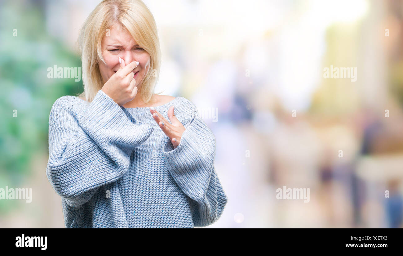 Young beautiful blonde woman wearing winter sweater over isolated ...