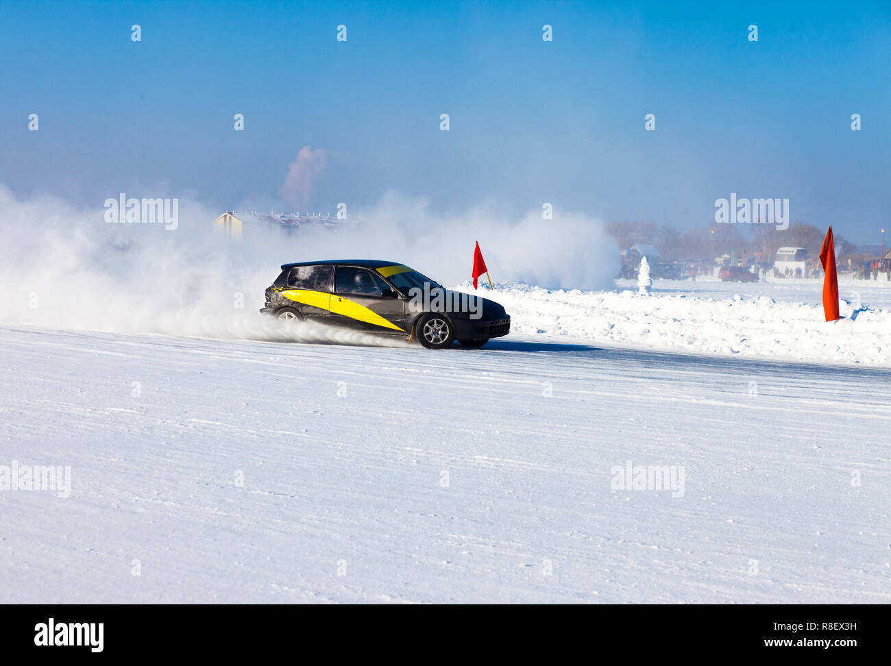Black car moving on ice making lots of ice splashes Stock Photo - Alamy