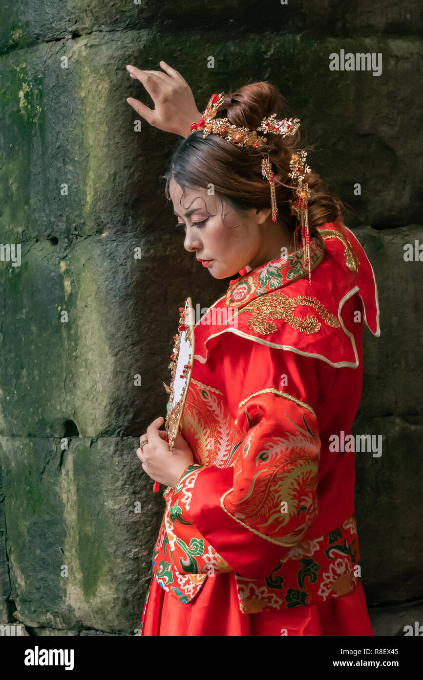 Woman in Red dress - Chinese woman in traditional costume posing in ...