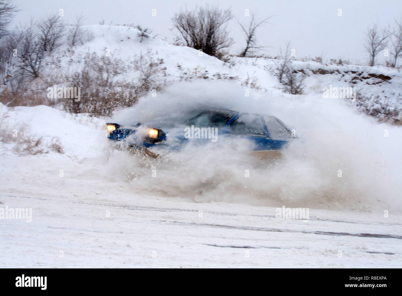 Cars riding a winter race Stock Photo - Alamy