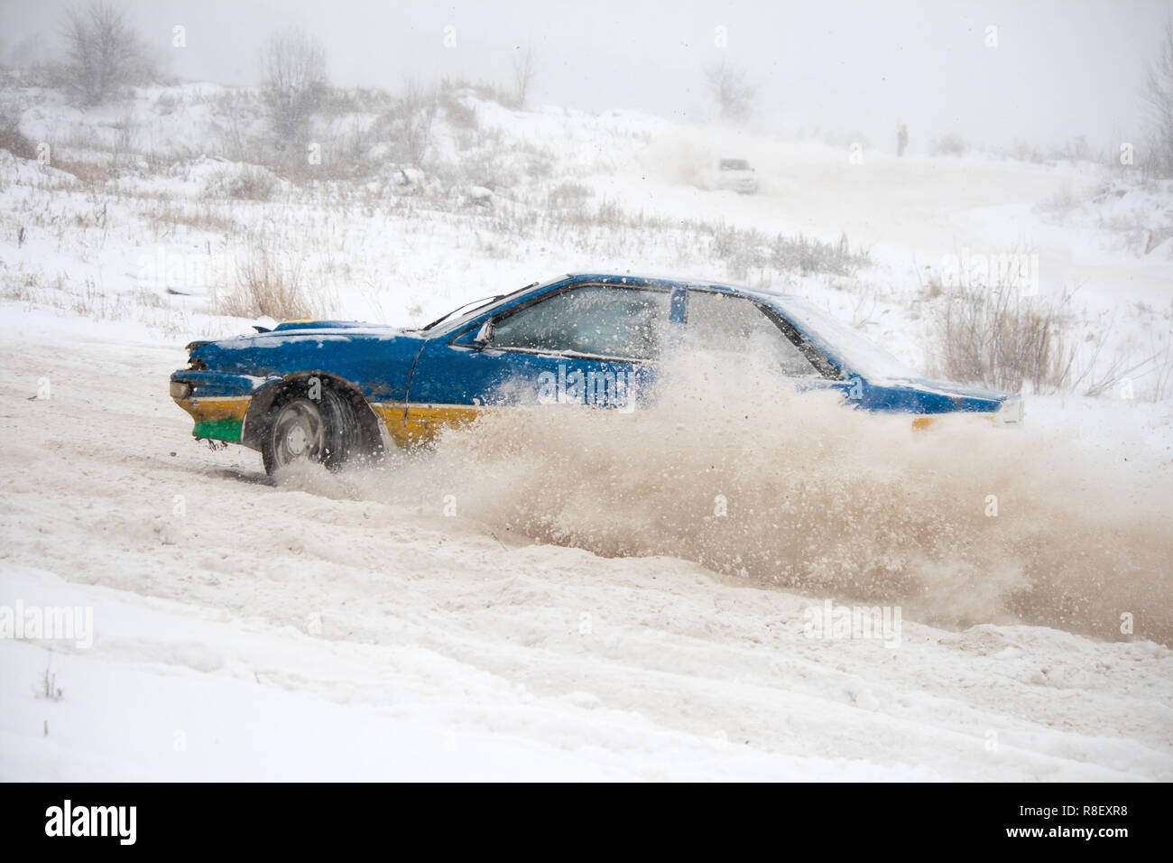 Cars riding a winter race Stock Photo - Alamy