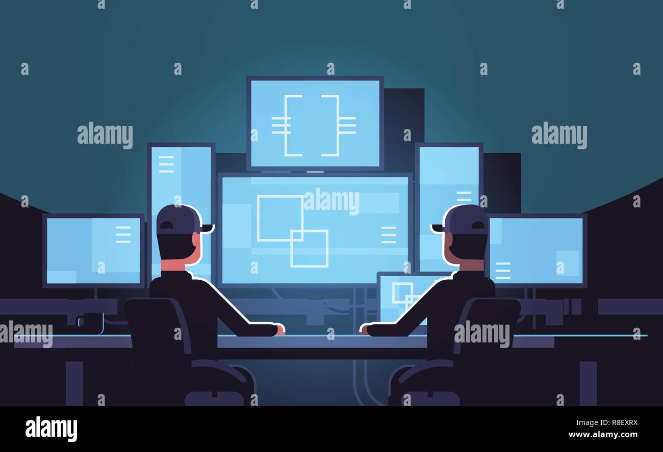 security workers watching video surveillance camera on monitor in ...