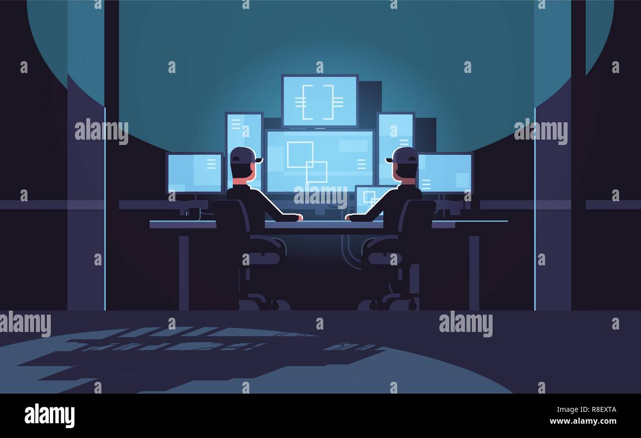 security workers watching video surveillance camera on monitor in ...