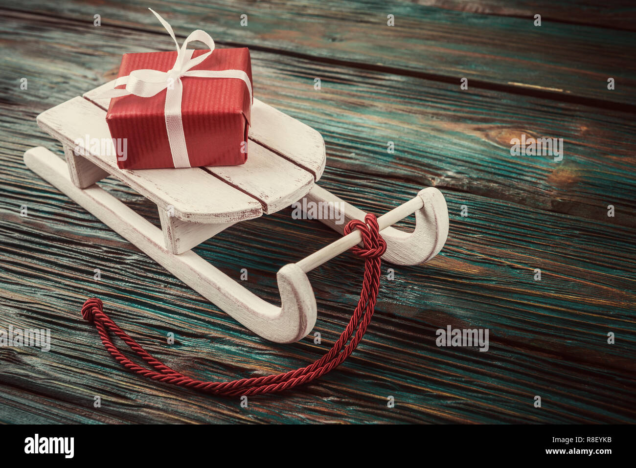Close up of Santa sledge with red gift box Stock Photo - Alamy