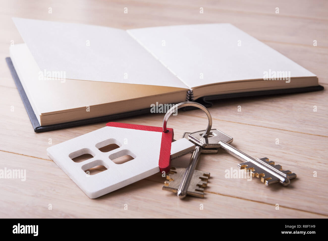 House model with keys and open sketchbook Stock Photo - Alamy