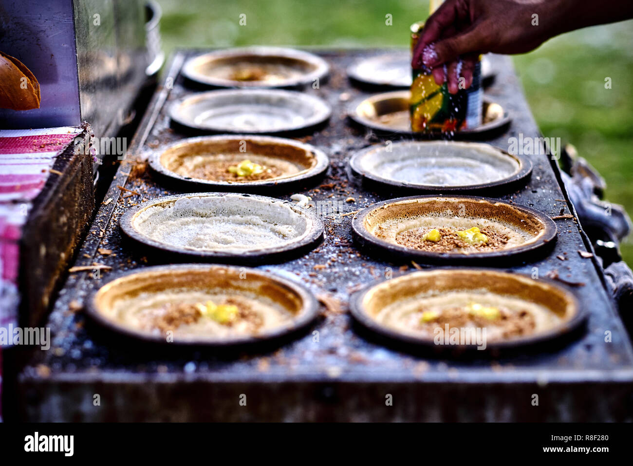 Cooking traditional asian pancakes. Indian and Chinese street food ...