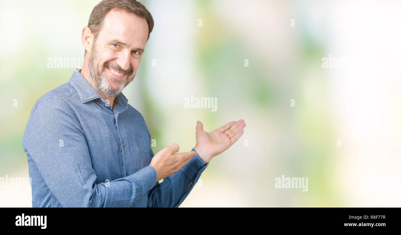 Handsome middle age elegant senior man over isolated background ...