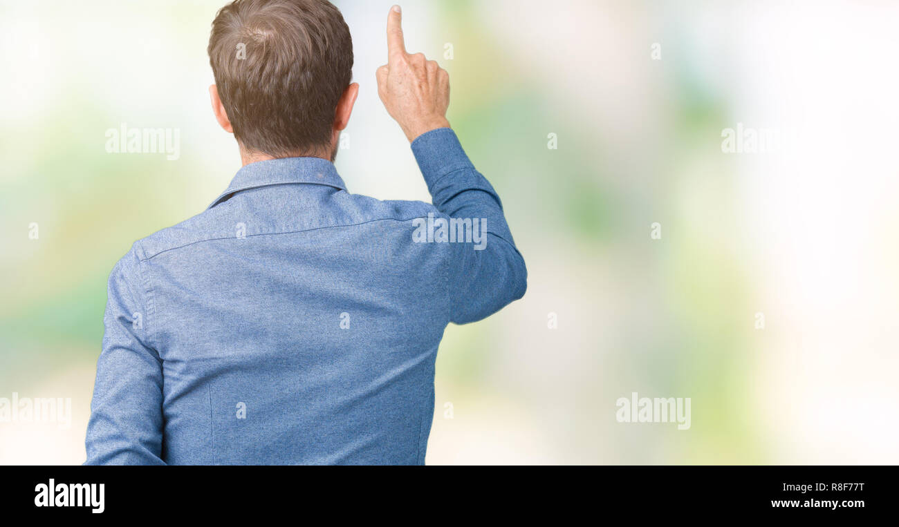 Handsome middle age elegant senior man over isolated background Posing ...