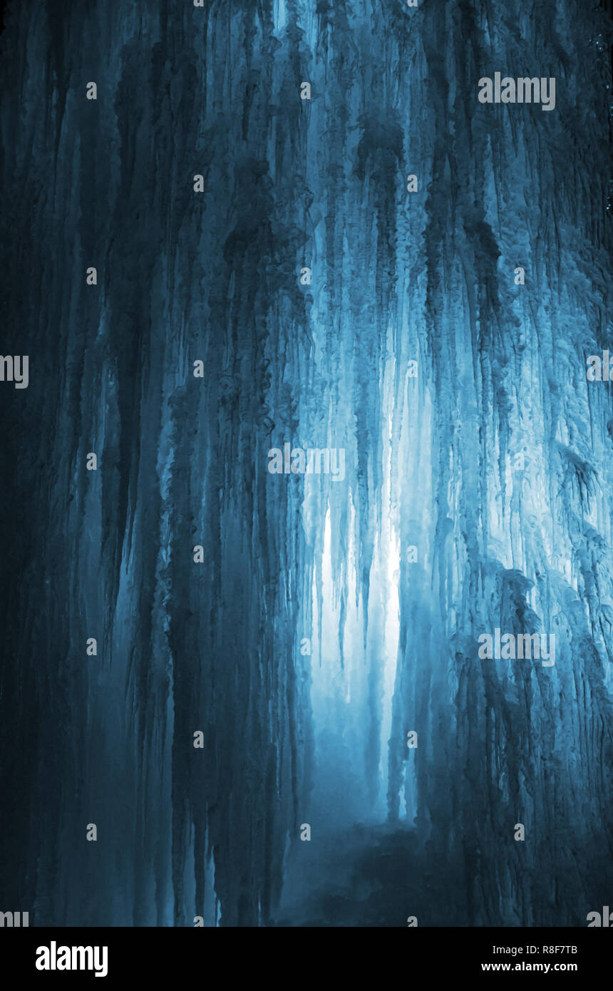 Huge ice icicles. Large blocks of ice frozen waterfall or water. Blue ...