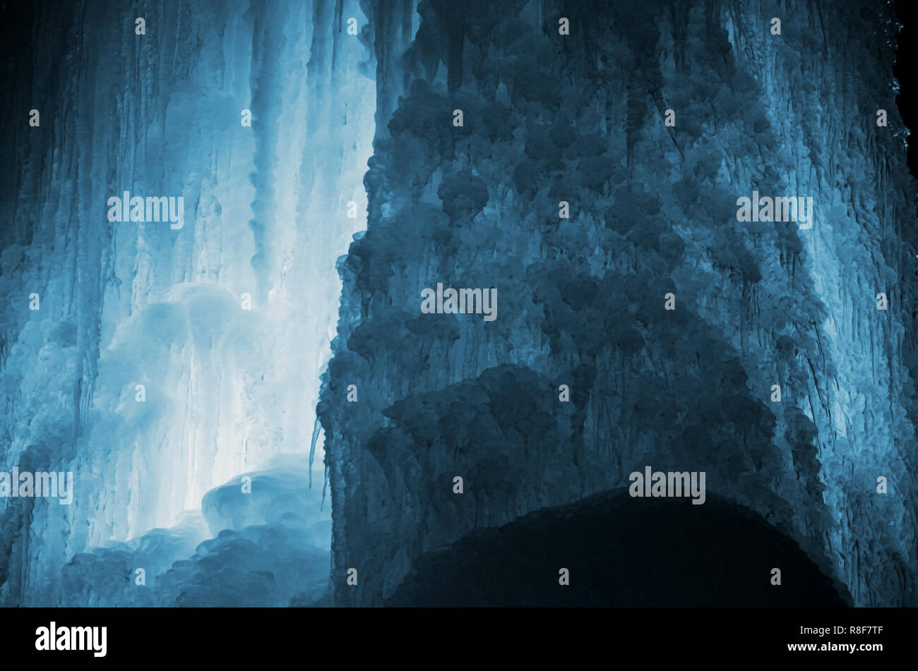 Huge ice icicles. Large blocks of ice frozen waterfall or water. Blue ...